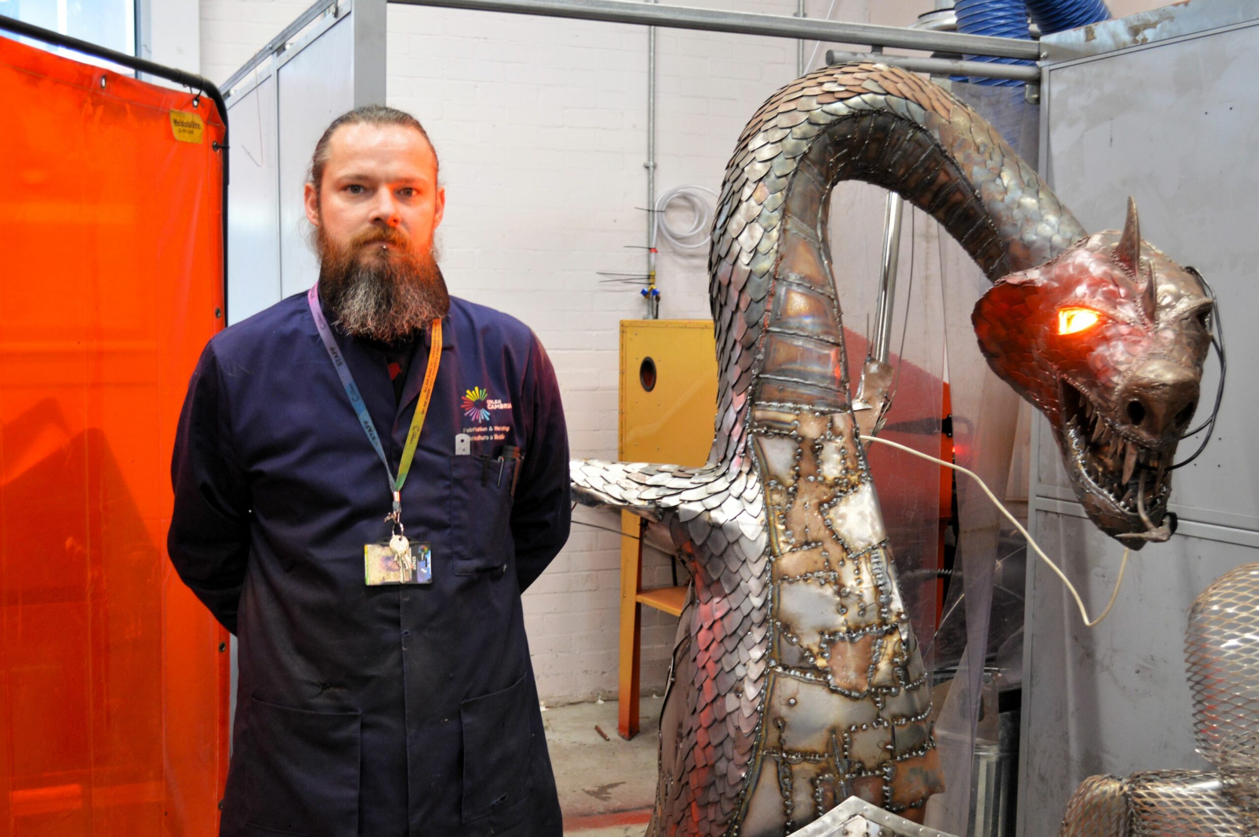 A four-metre dragon constructed from thousands of weapons will breathe ...